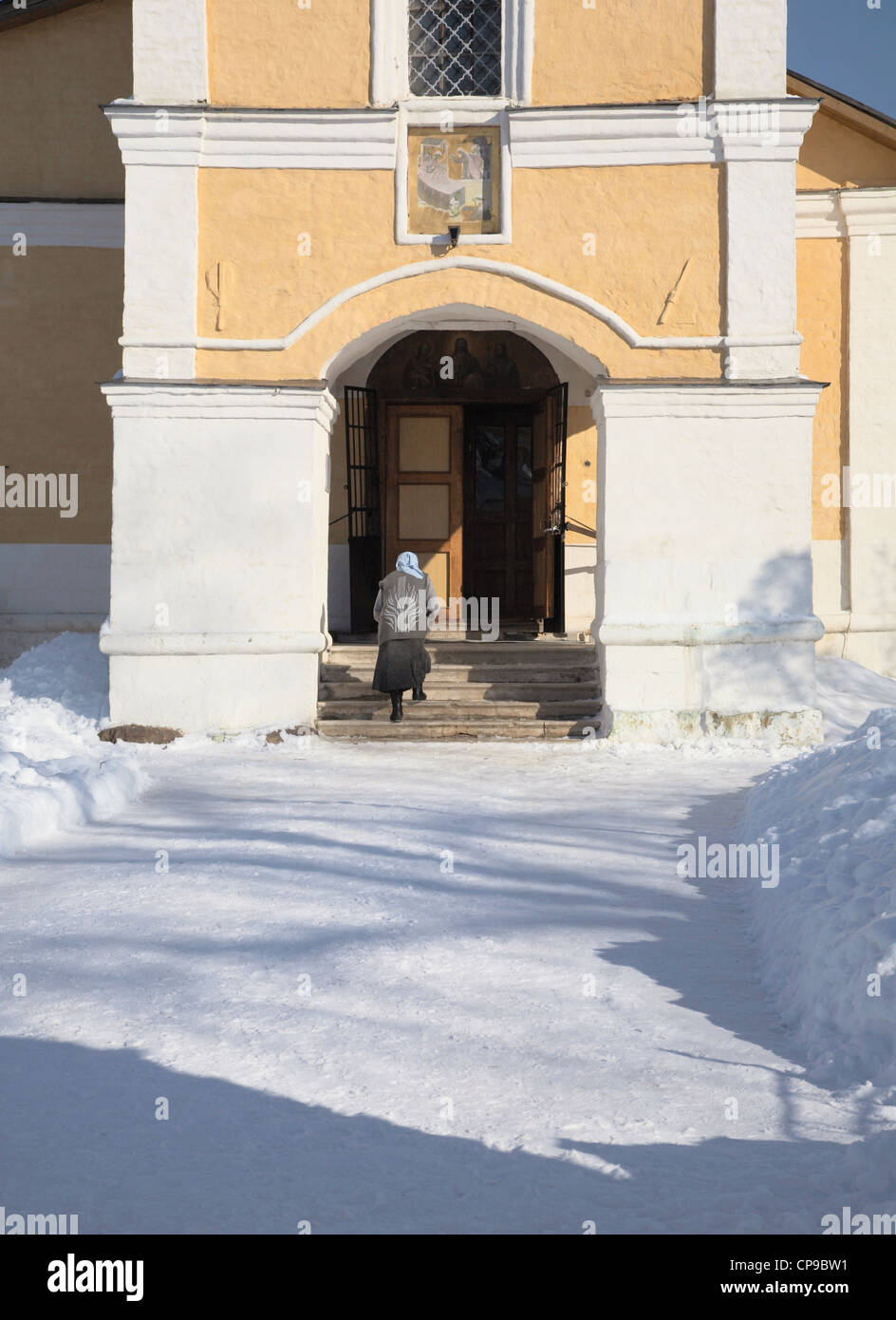 The old woman is included into church in the winter afternoon Stock ...
