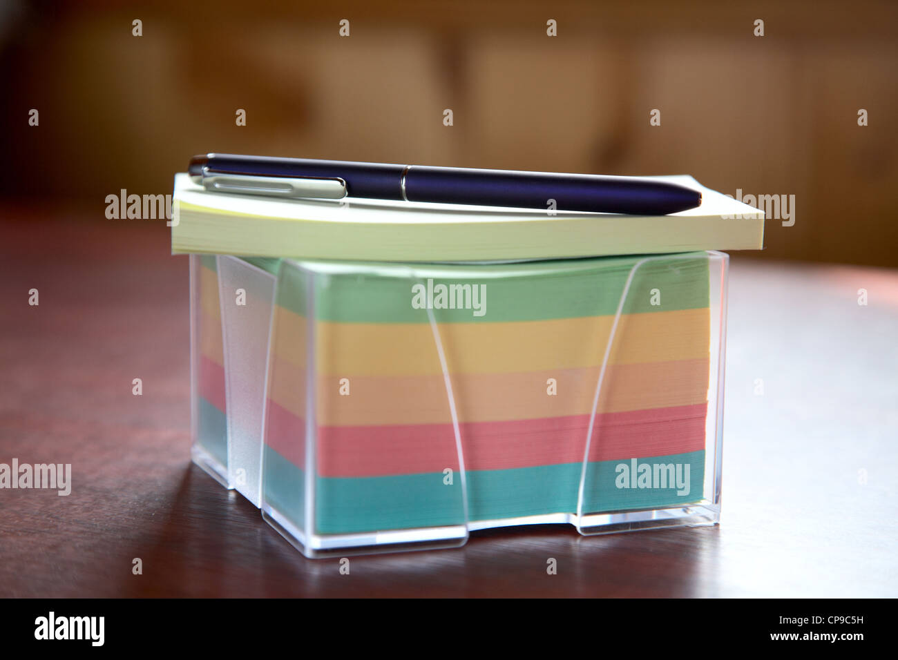 Pile of sticky note and pen on a desk Stock Photo - Alamy