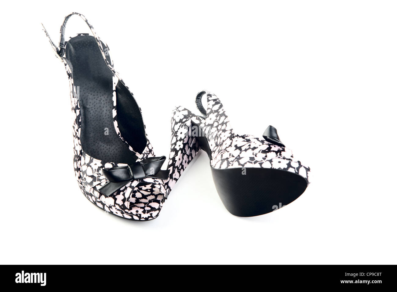 pair of female shoes on a high heel white background Stock Photo - Alamy