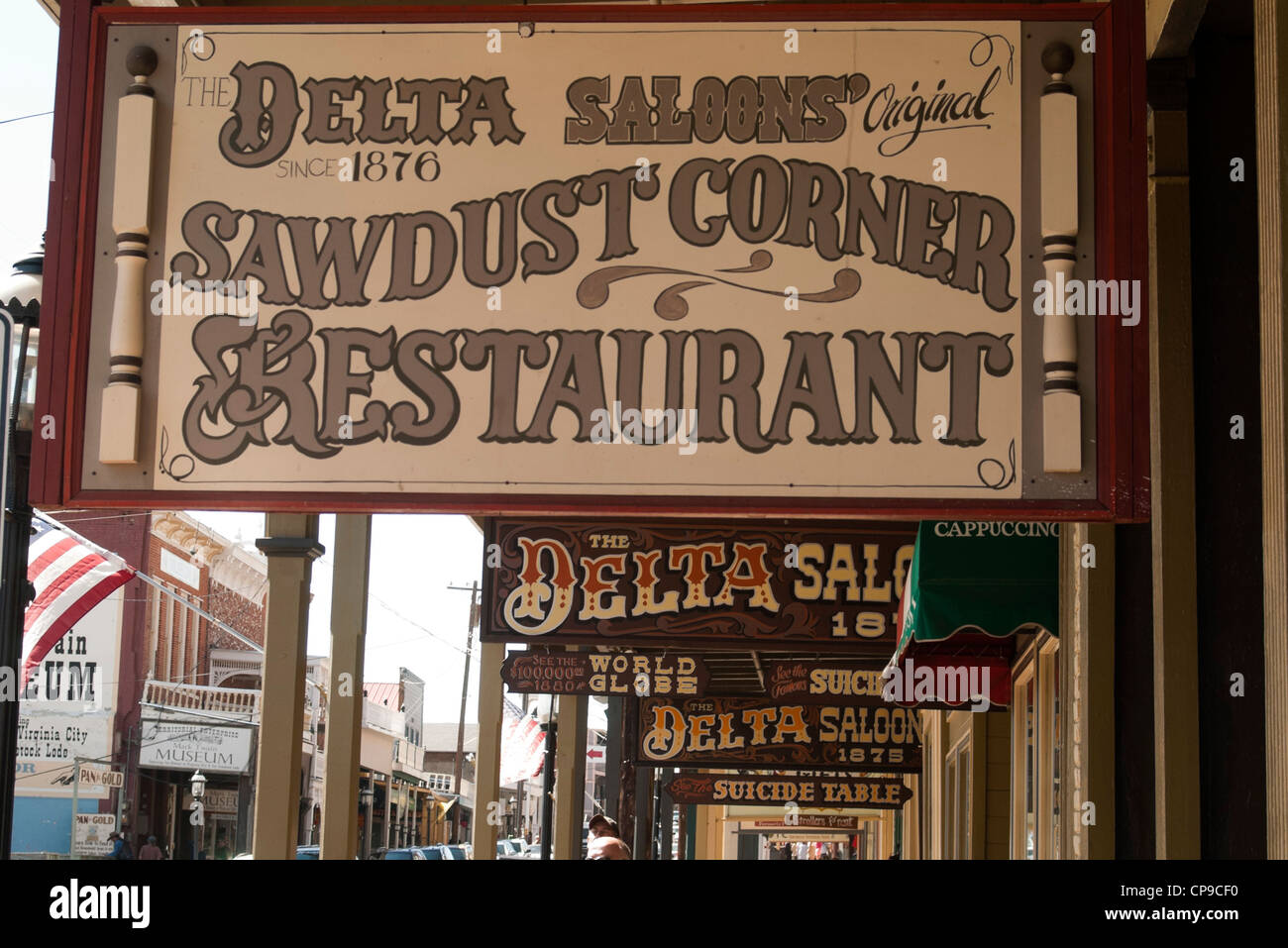 Delta Saloons signs hang from roof of covered walkway on C Street over ...