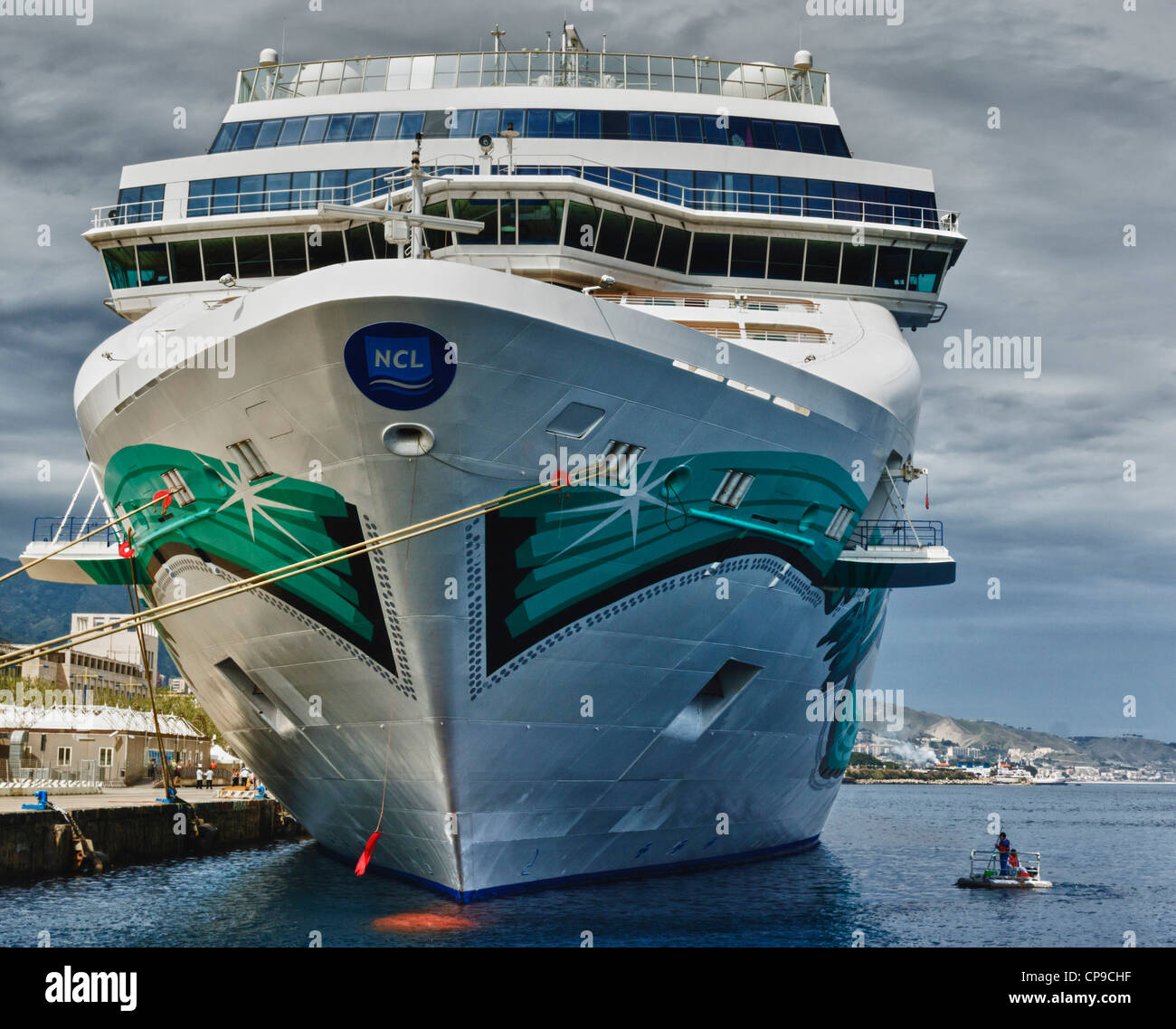 Painting a cruise ship during a port visit - anti-fouling paint applied ...