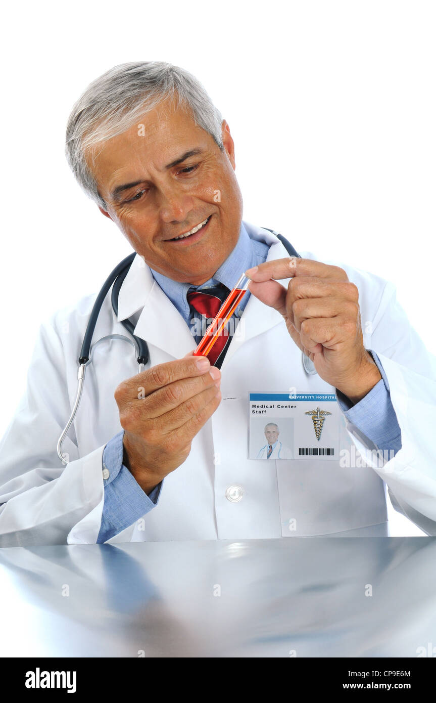 Middle aged lab technician examining the contents of a test tube ...