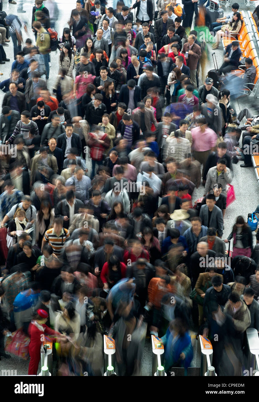 Passengers queuing at ticket gates at Hongqiao railway station in ...