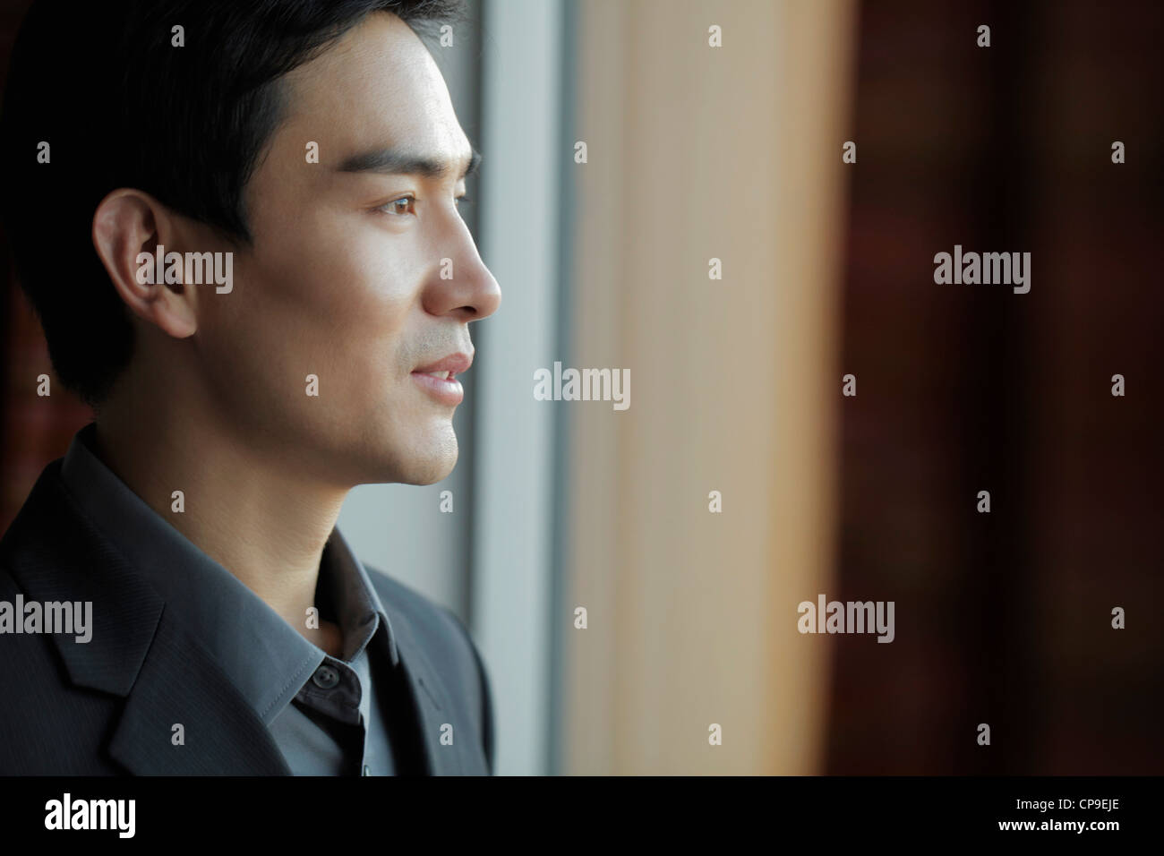 Profile of man wearing a jacket Stock Photo - Alamy