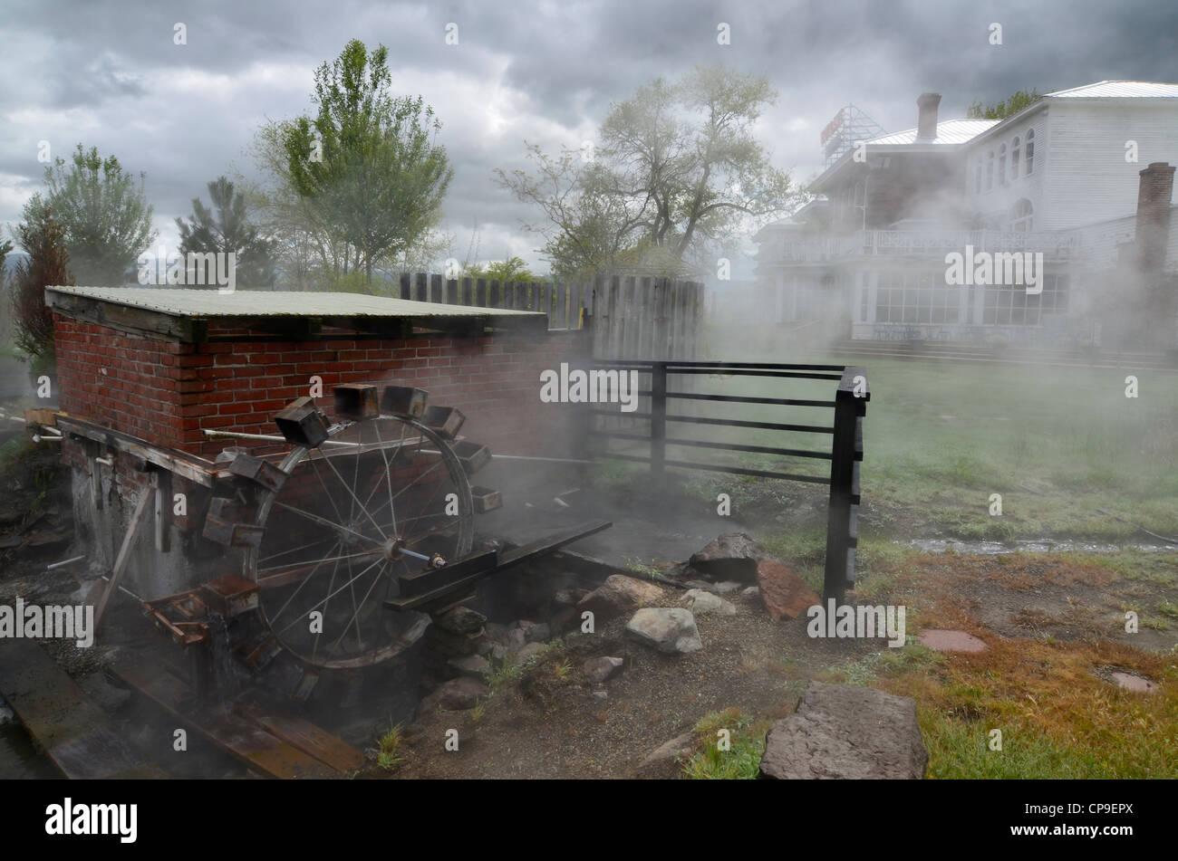 The steam from Hot Lake rises by a waterwheel in front of the Hot Lake ...