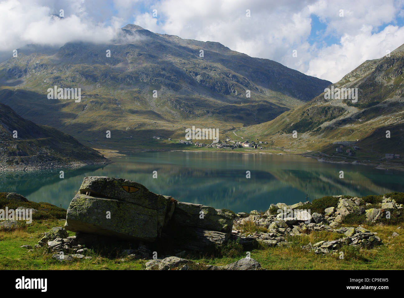 Lake Montespluga with village of Montespluga and Alps, Italy Stock ...