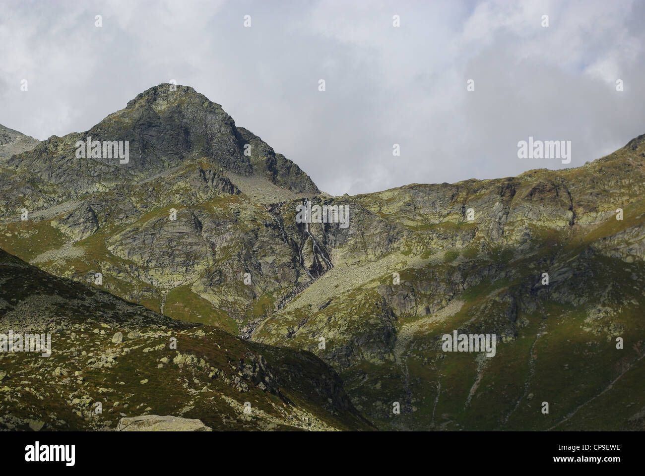 Rugged Alps and waterfall near Lake Montespluga, Italy Stock Photo - Alamy