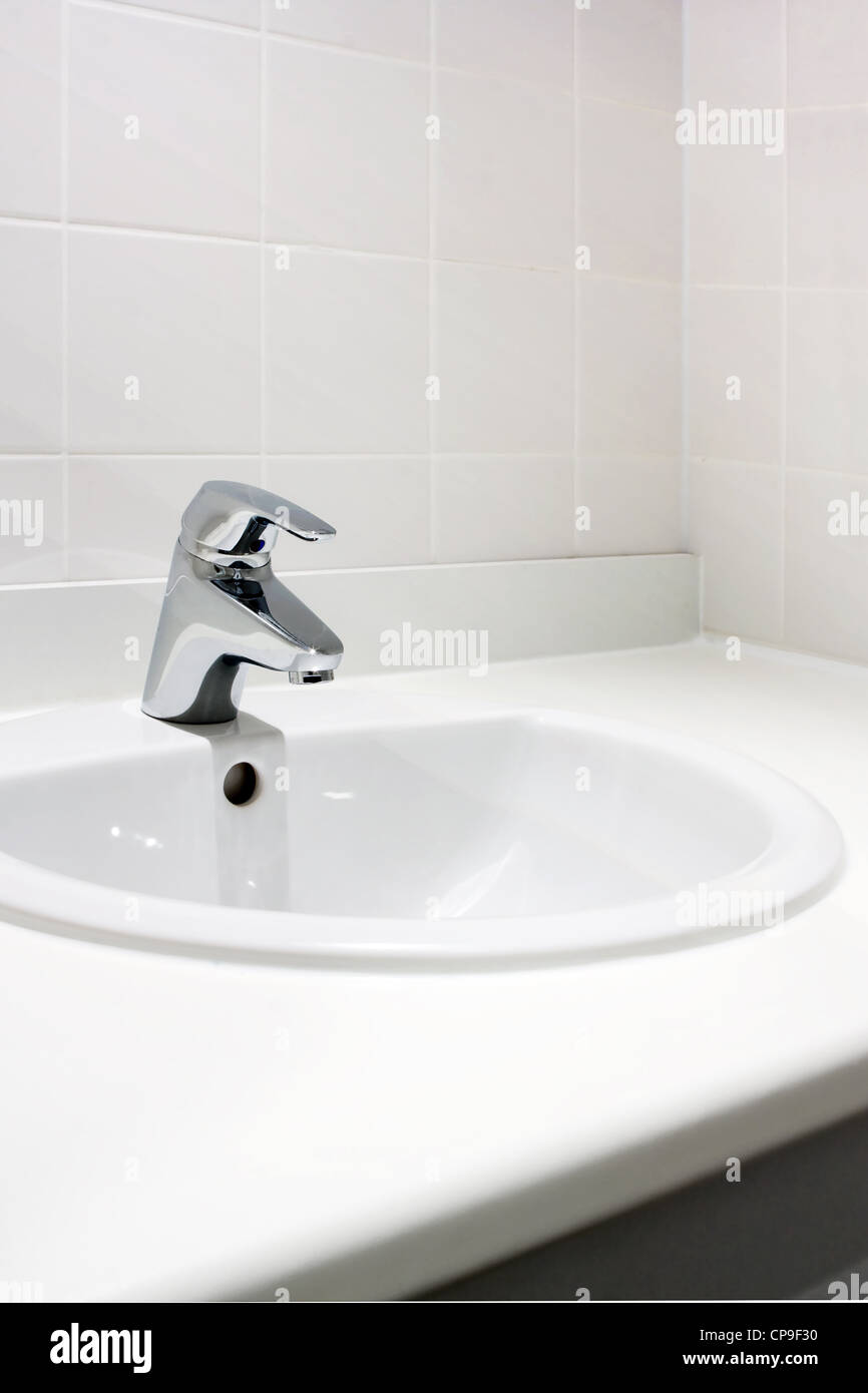 Fresh and clean washbasin and chrome tap Stock Photo - Alamy