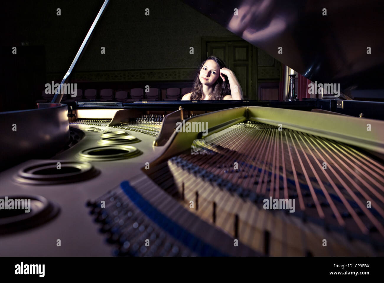 indoor portrait of a young female piano player Stock Photo - Alamy
