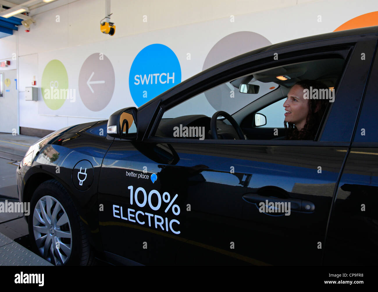 A battery of an electric car is being swapped at Better Place's ...