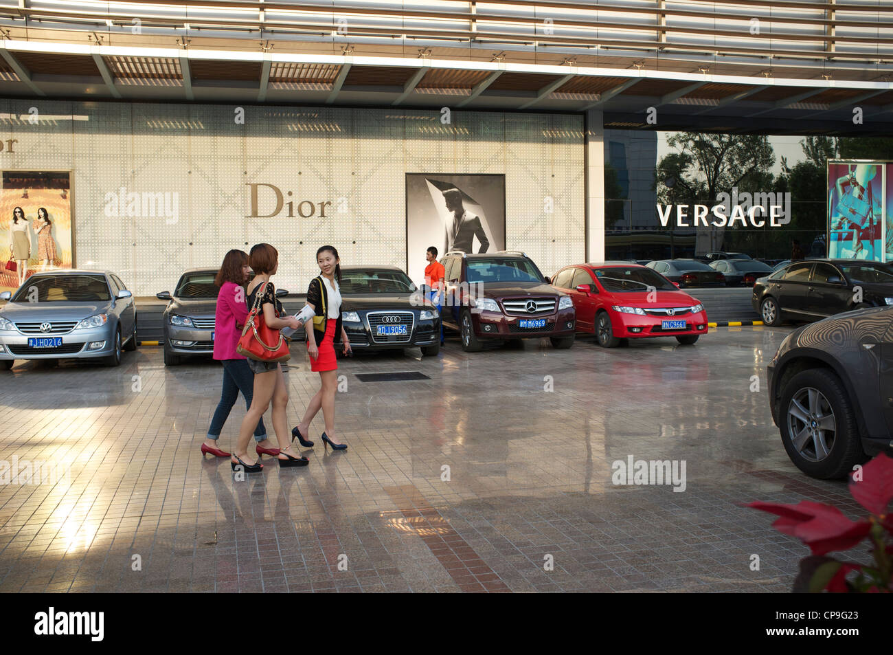 Chinese ladies walk into Friendship Department Store, the first high ...