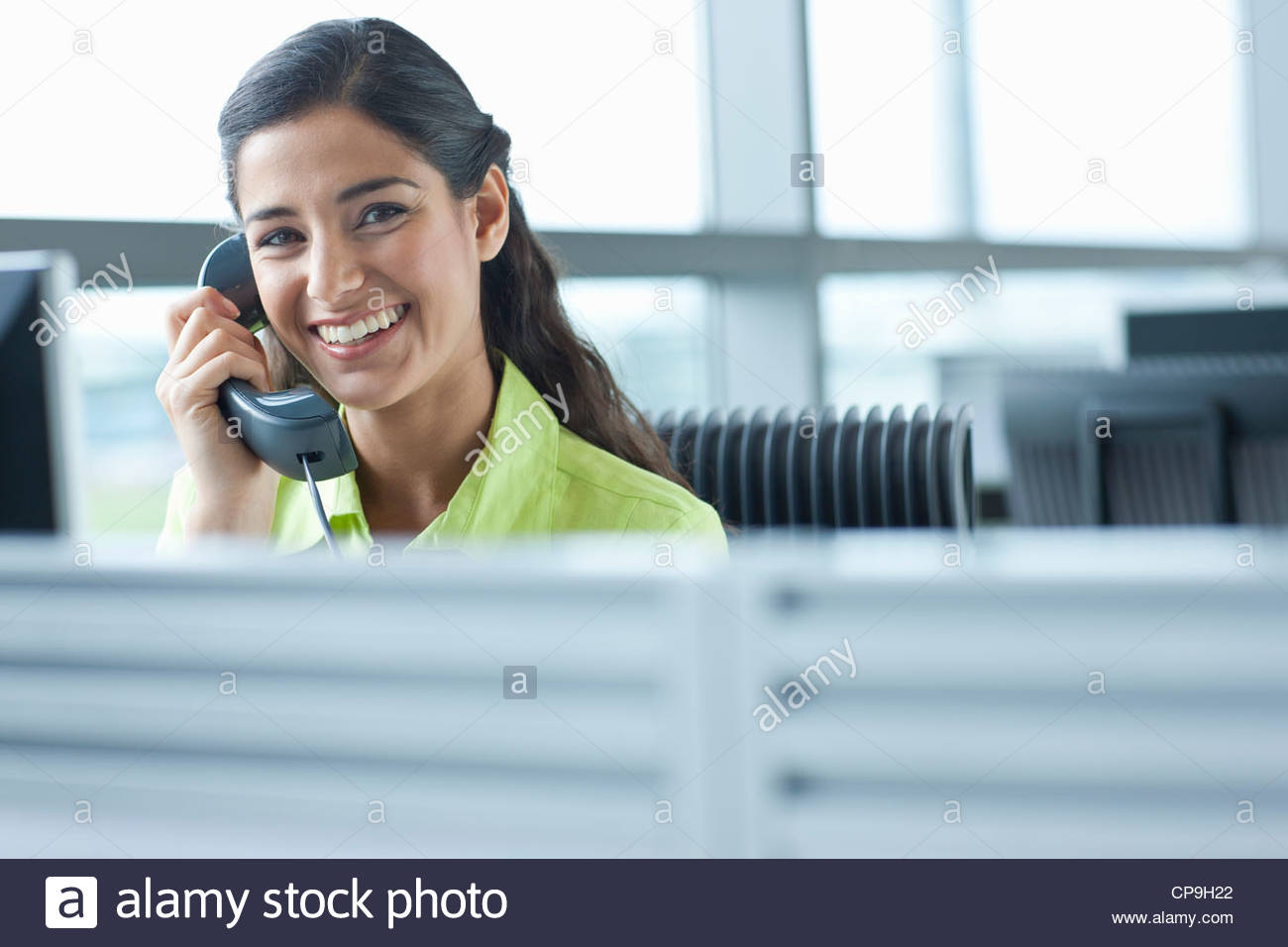 Receptionist Answering Phone Stock Photos & Receptionist Answering ...