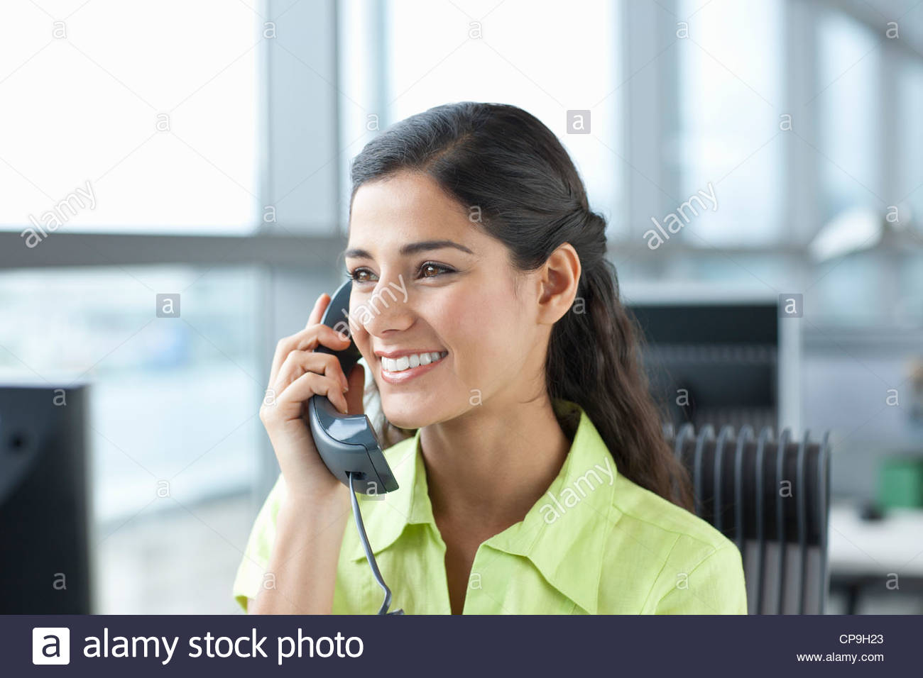 Receptionist Answering Phone Stock Photos & Receptionist Answering ...
