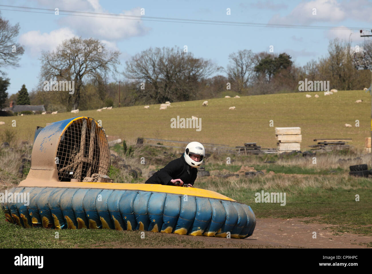 Man riding around a race course on a miniature hovercraft. The novel ...