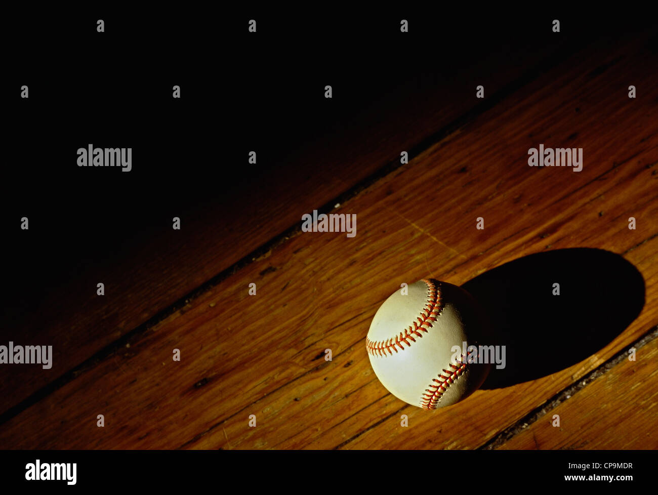 Baseball on wood floor Stock Photo - Alamy