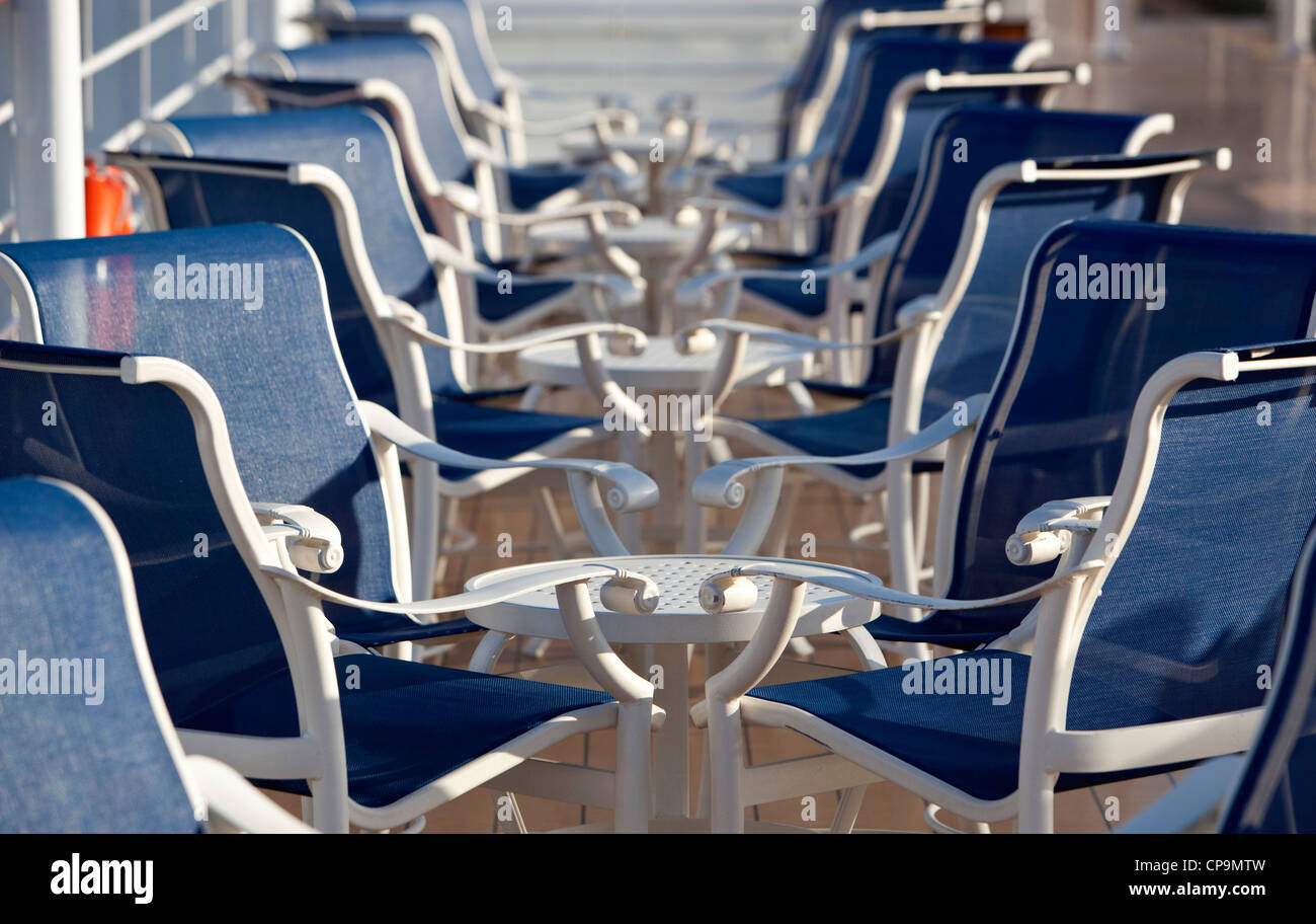 Deck tables and chairs on the deck of a passenger ship Stock Photo - Alamy