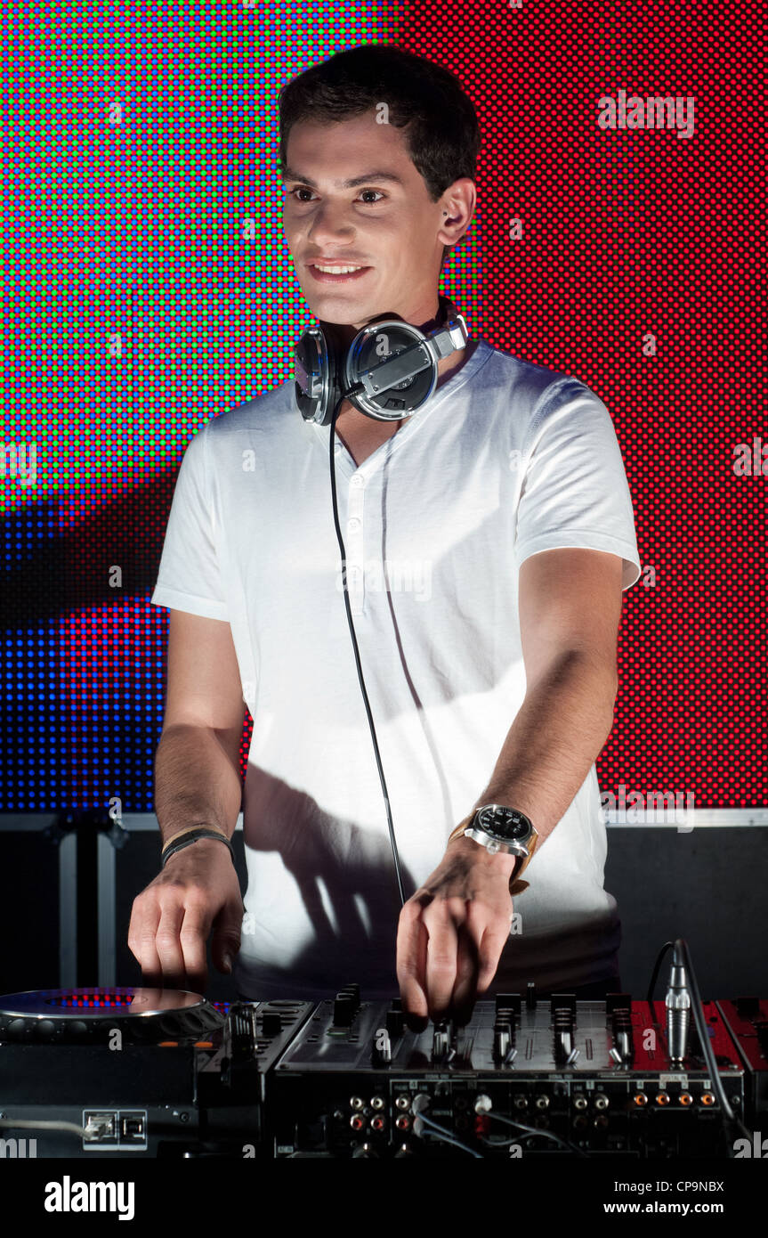 Dj in action, playing disco house music Stock Photo - Alamy