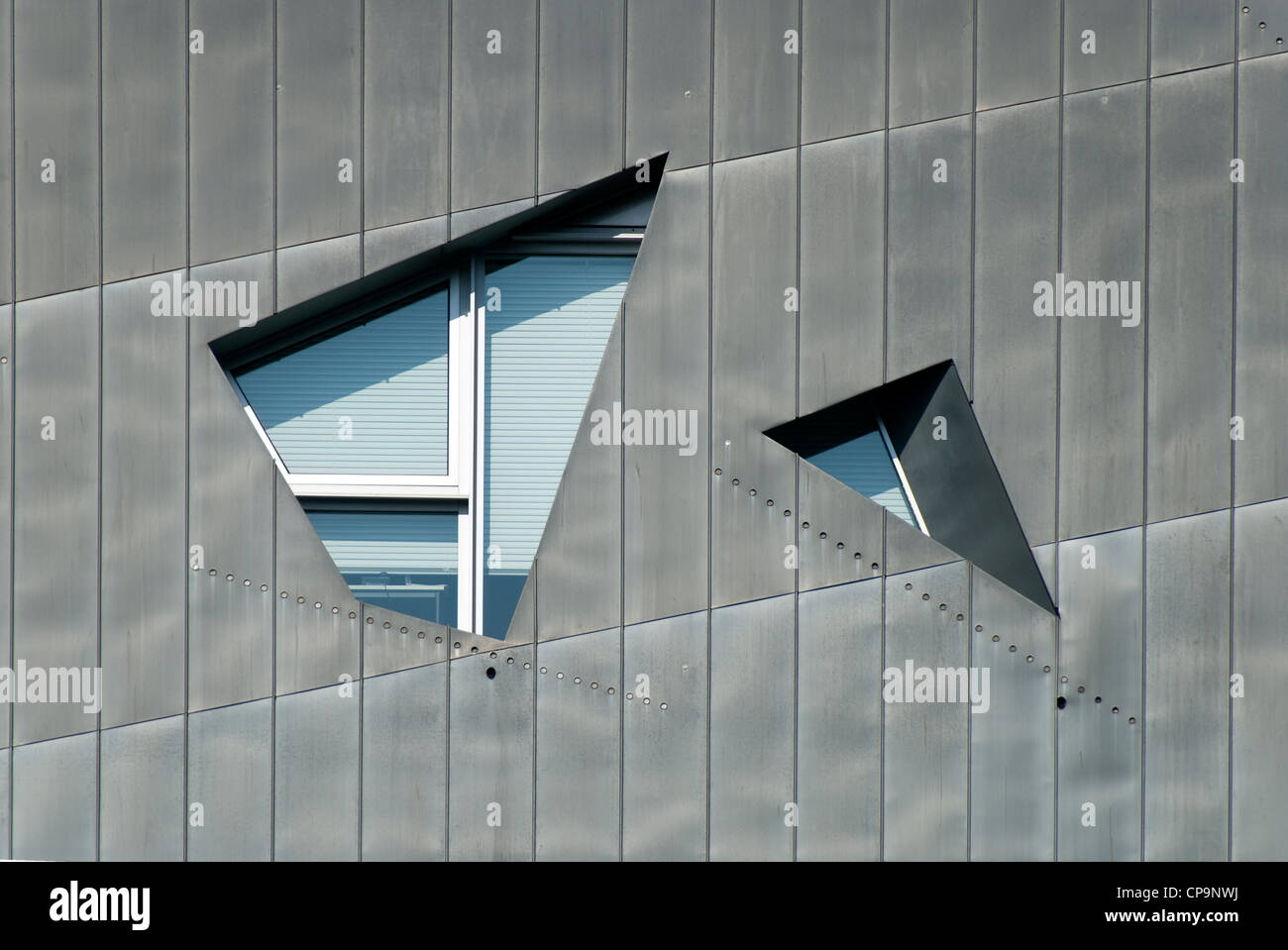 Bigger trapeziform window on left & a smaller triangular window on ...