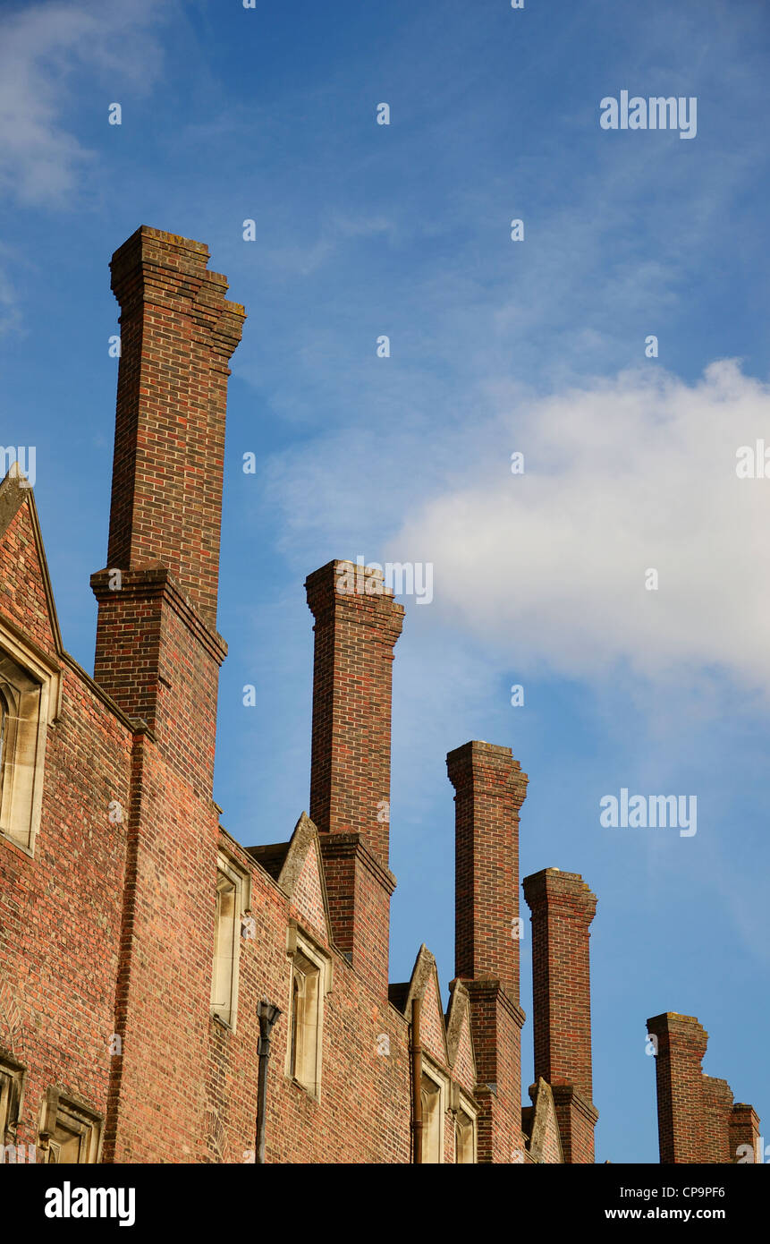 top of building showing rooftops and chimneys with blue sky and clouds ...