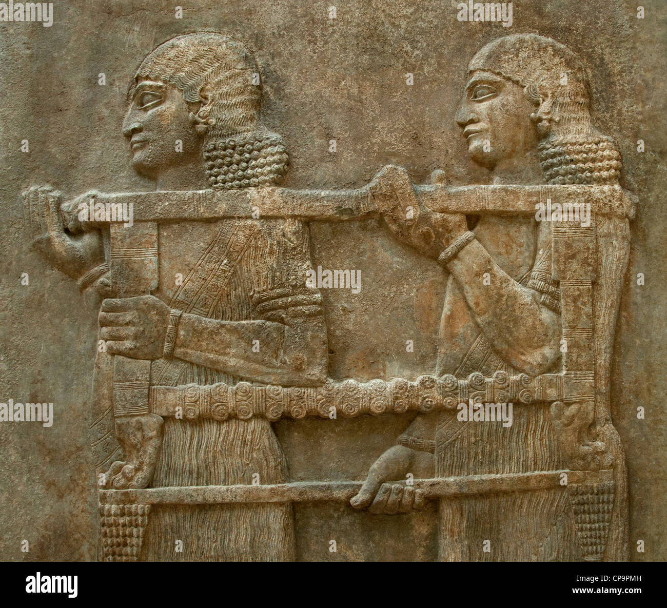 Two servants carrying a chair and a vase Neo Assyrian Sargon II 721-705 ...
