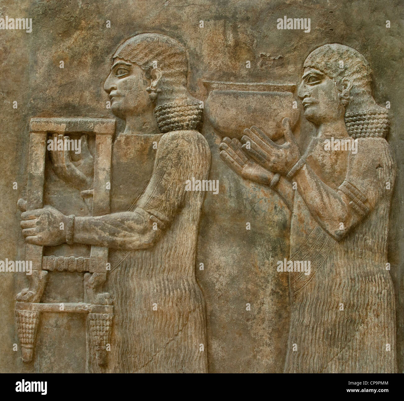 Two servants carrying a chair and a vase Neo Assyrian Sargon II 721-705 ...