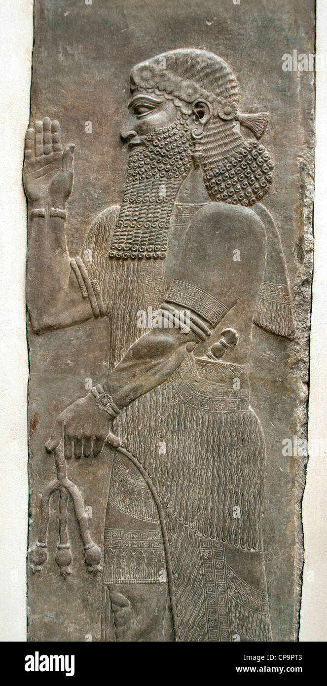 Figure holding a poppy flower Neo Assyrian Sargon II 721-705 BC ...