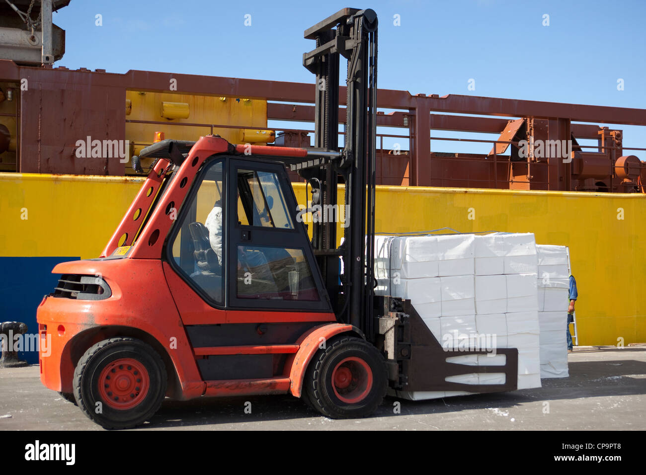 Forklift transferring paper cargo to the warehouse at Montrose Docks ...