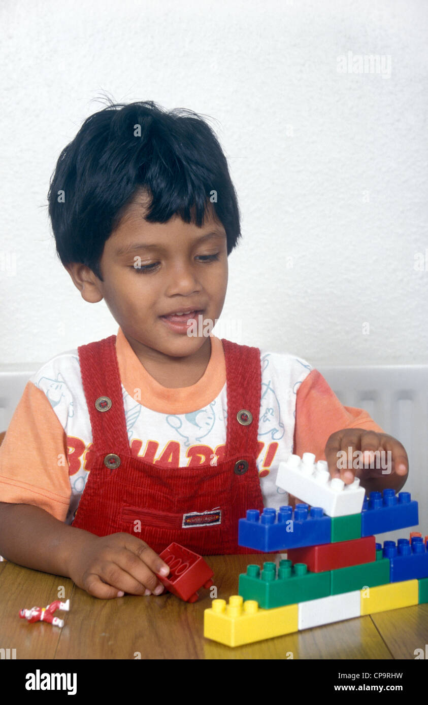 child building with lego bricks Stock Photo - Alamy