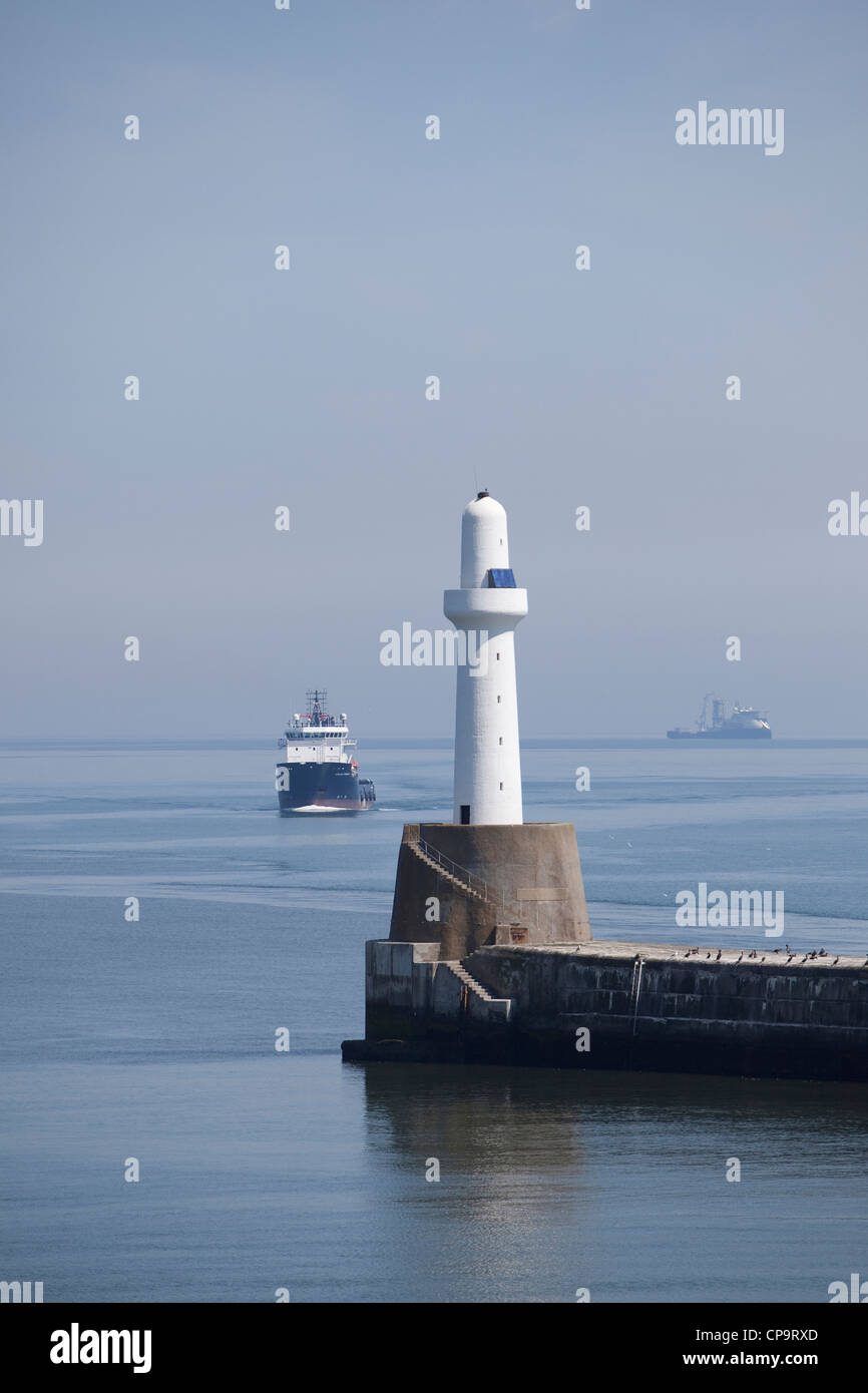 A support vessel for the offshore oil rig approaching Aberdeen harbour ...