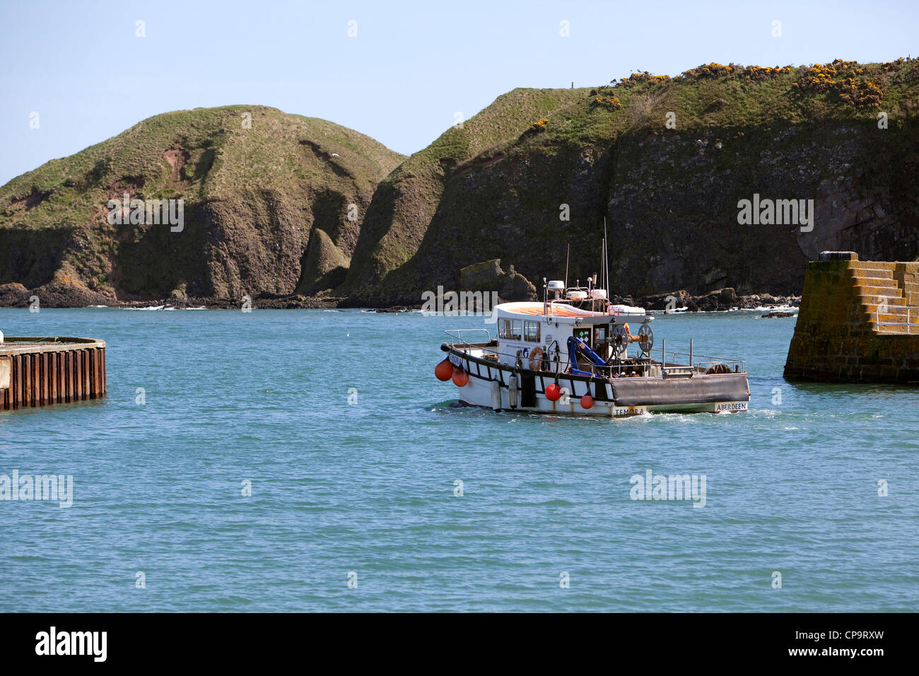 Fishing boat sailing from Stonehaven harbour Stock Photo - Alamy