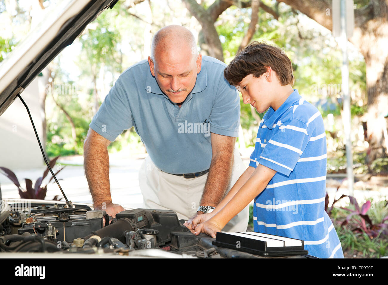 Son helping father for fixing car hi-res stock photography and images ...