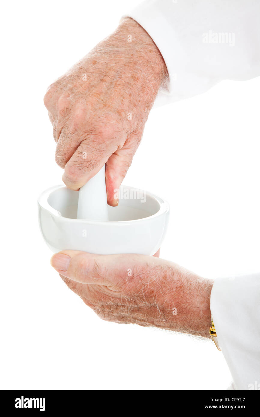Closeup of hands using a mortar and pestle. Isolated on white Stock ...