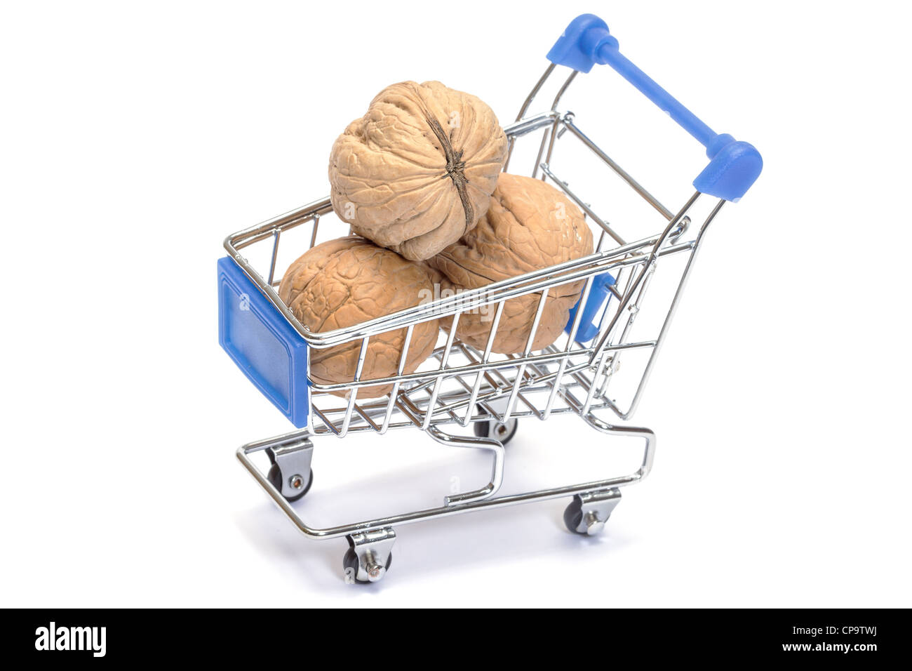 Walnuts in shopping cart isolated on white background Stock Photo - Alamy