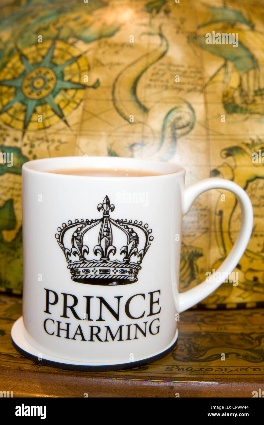 Prince charming cup of tea on retro drinks globe Stock Photo - Alamy