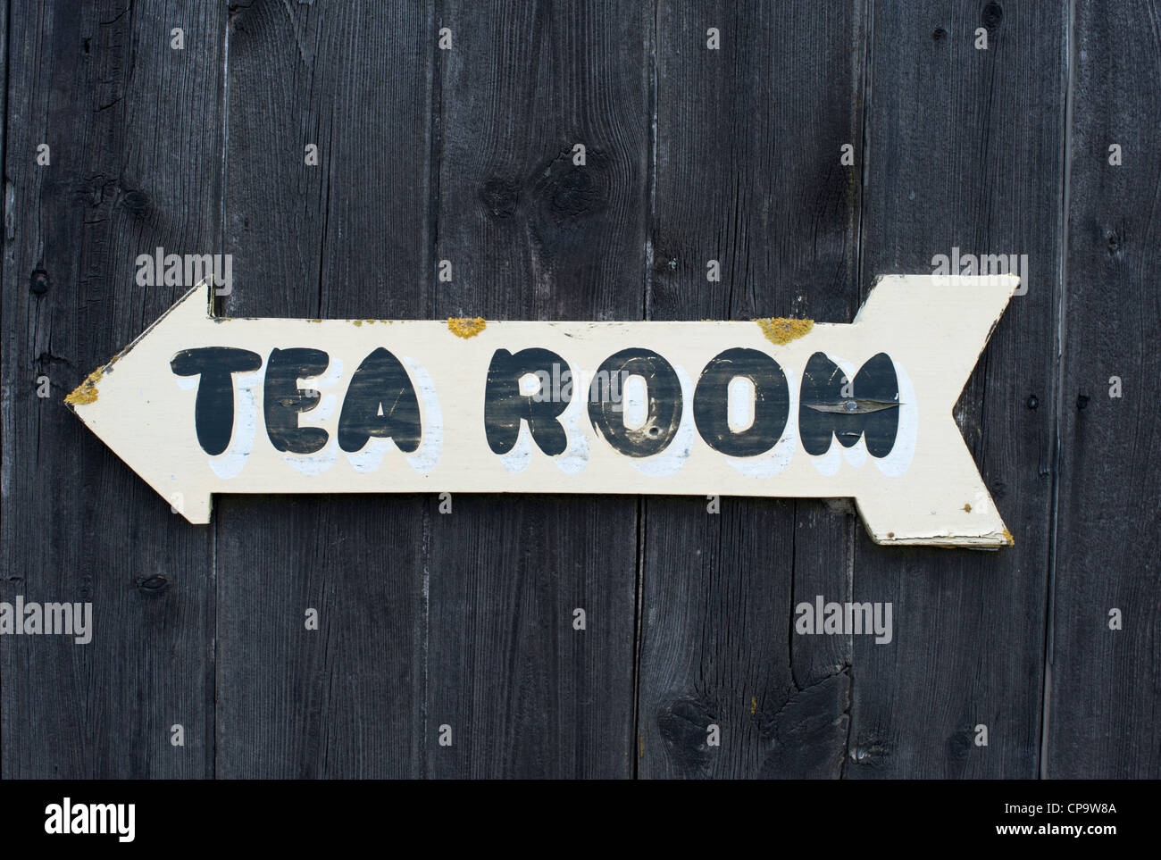tea room arrow and direction sign on wooden shed Stock Photo - Alamy