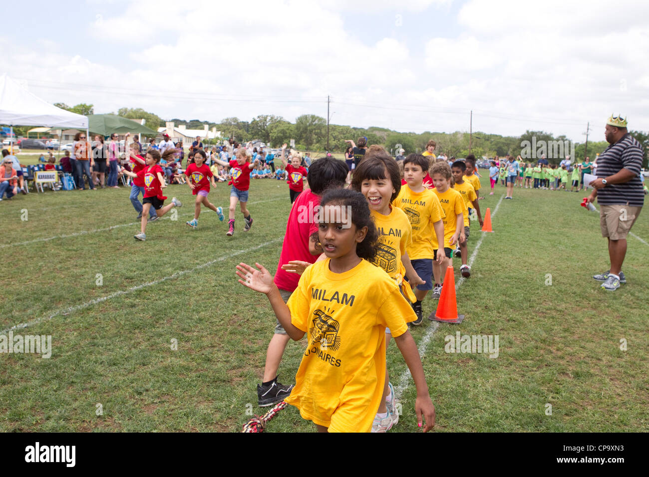 Second grade elementary school age kids participate in tug-of-war ...