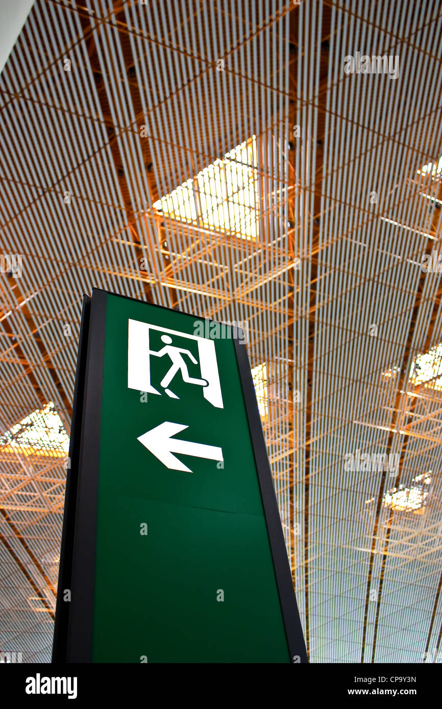 Sign of emergency exit in a Chinese airport, good for conceptual Stock ...