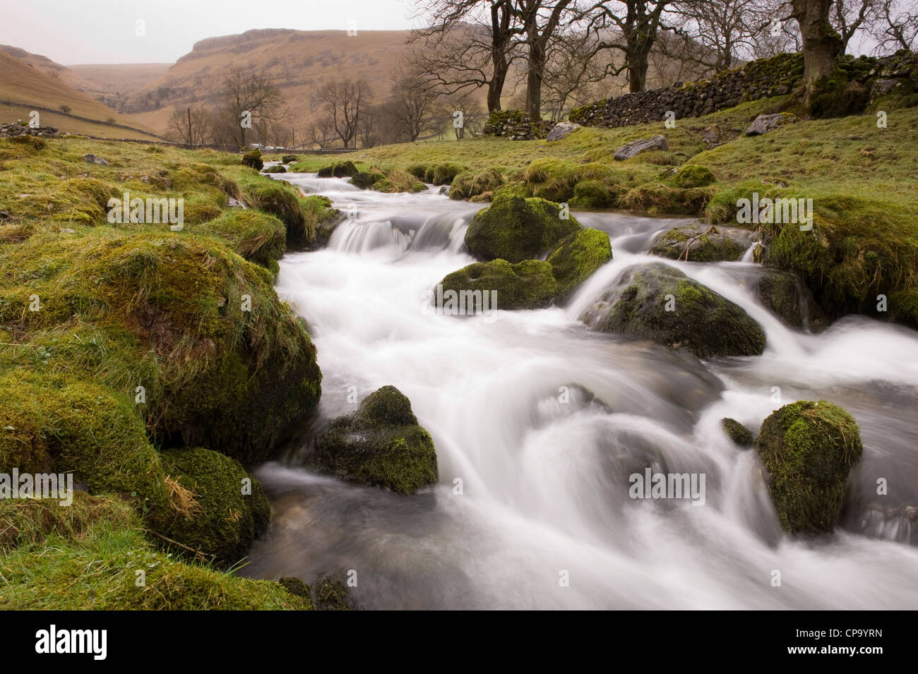Water in Gordale Beck stream rushing & flowing down over rocks in ...