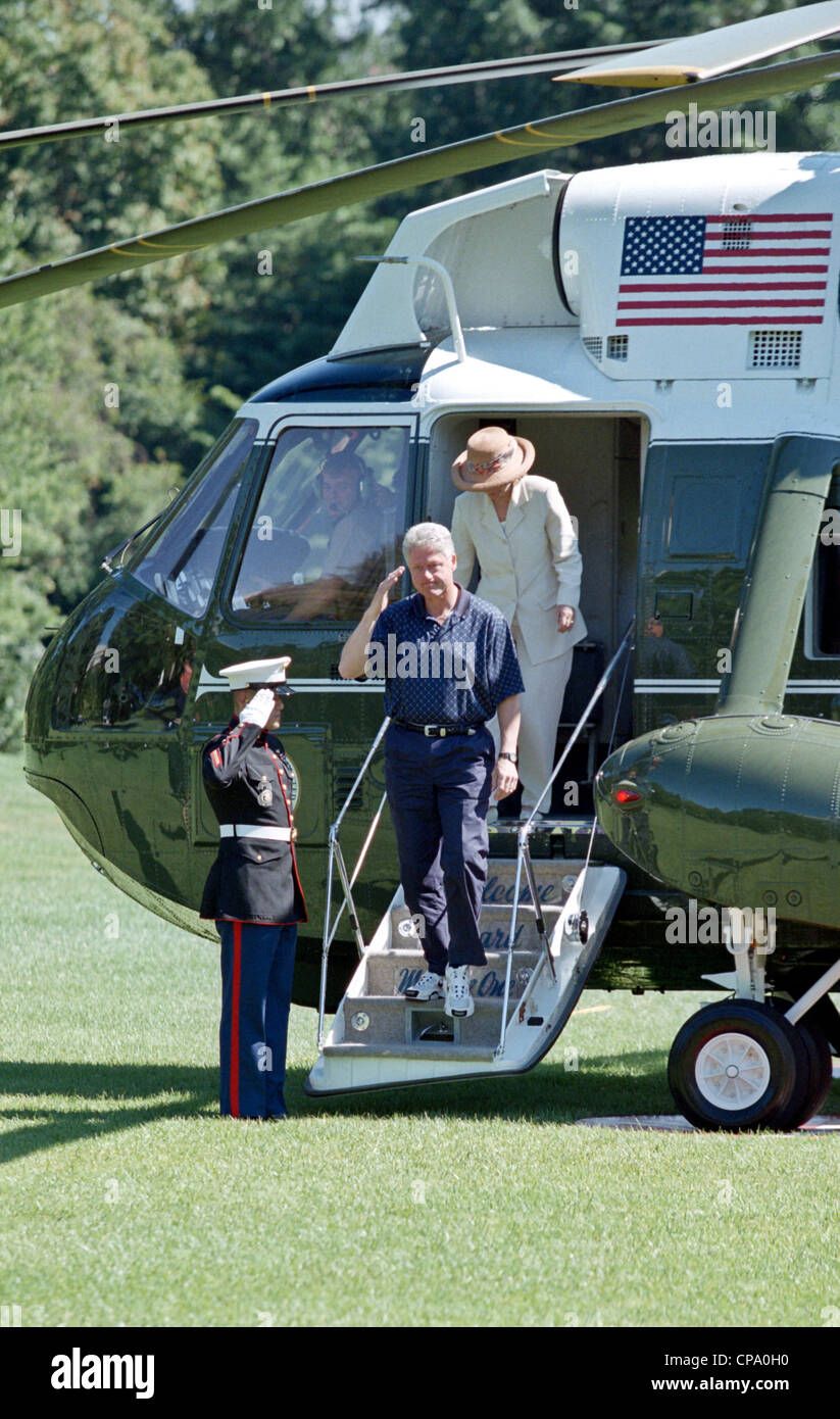 President Bill Clinton and first lady Hillary Clinton return from a ...