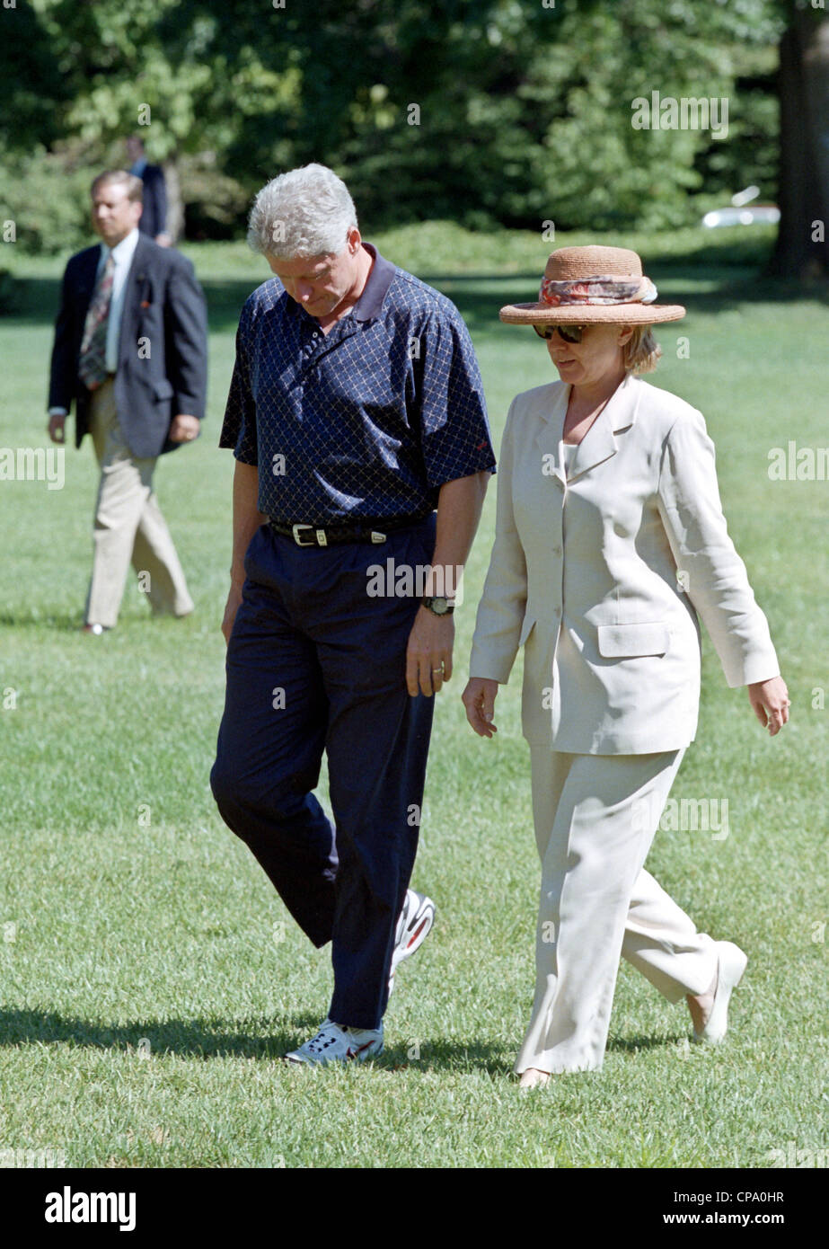 President Bill Clinton and first lady Hillary Clinton return from a ...