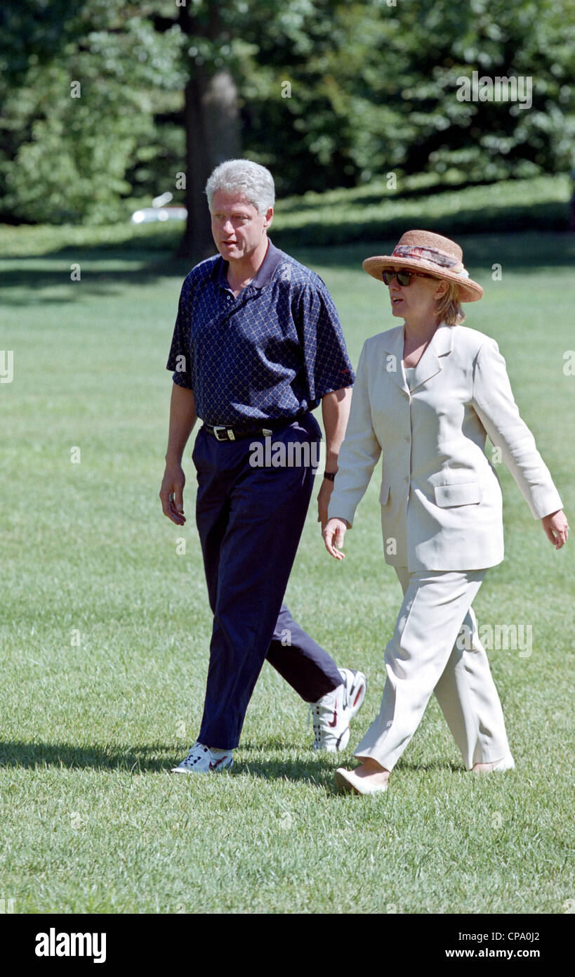 President Bill Clinton and first lady Hillary Clinton return from a ...