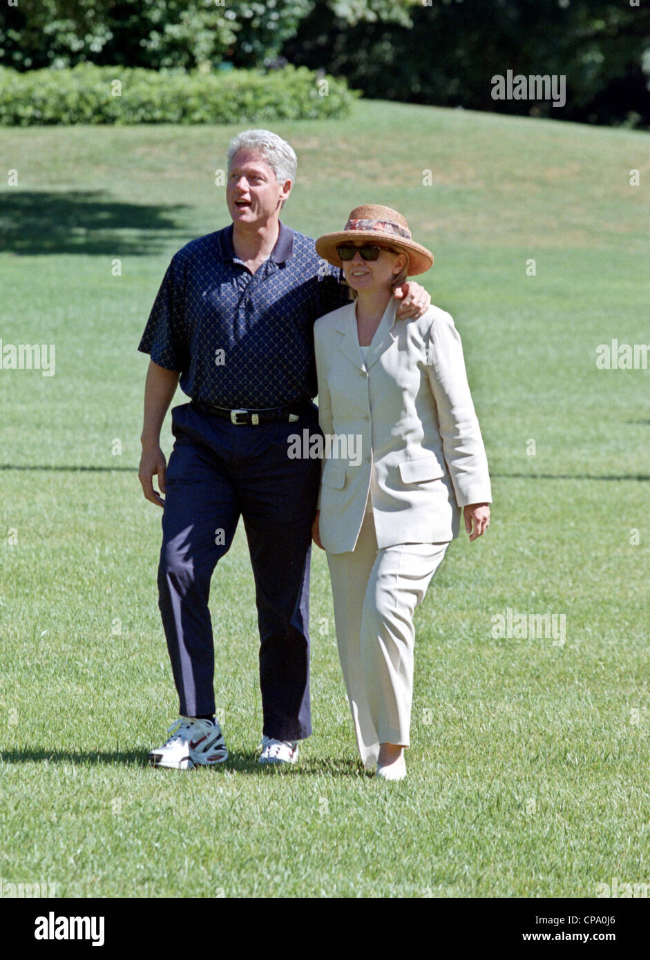 President Bill Clinton and first lady Hillary Clinton return from a ...