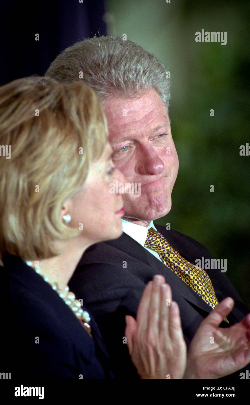 US President Bill Clinton with wife Hillary react during a ceremony on ...