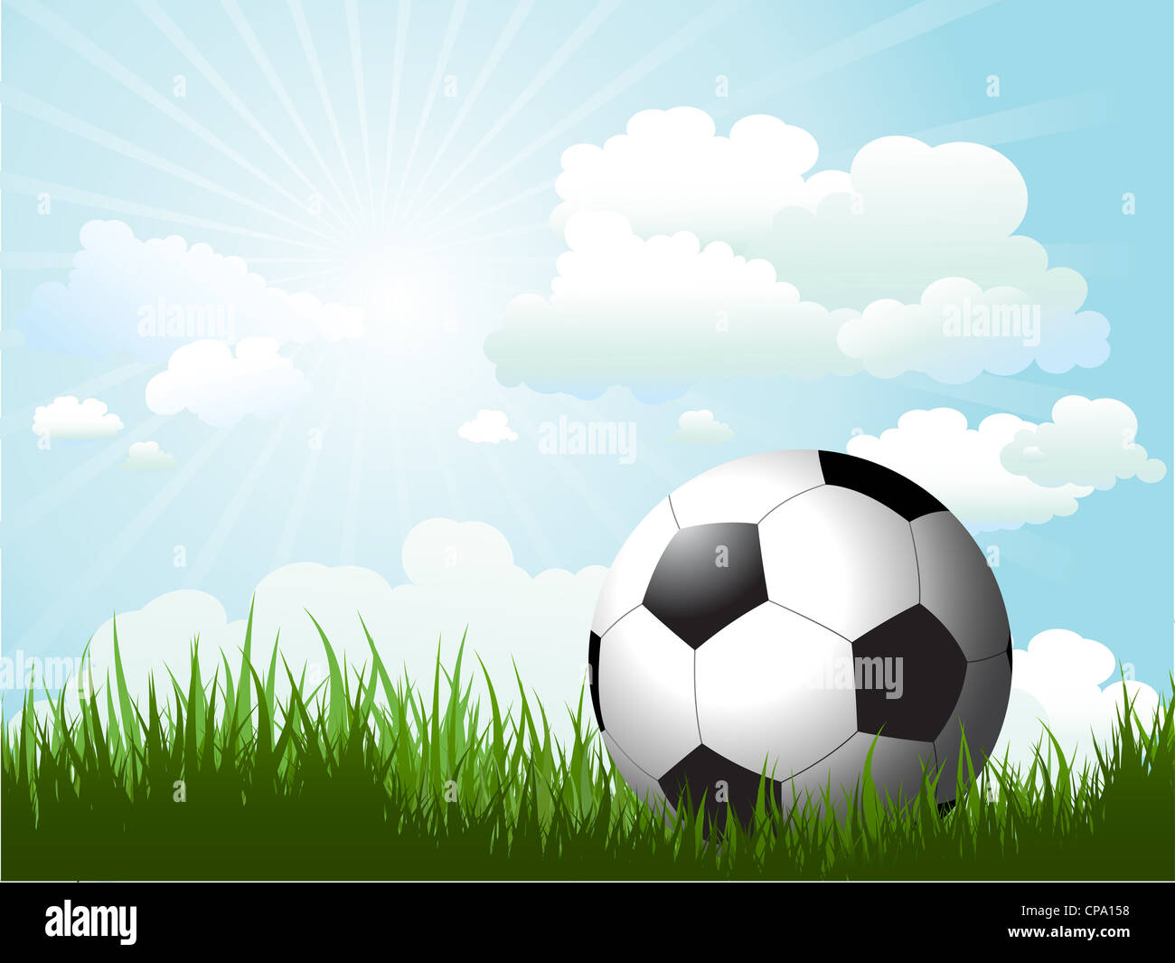 Football in grass against a sunny sky Stock Photo - Alamy