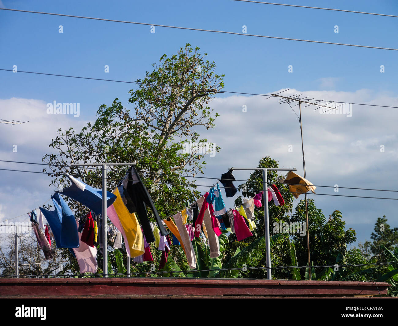 Colorful laundry drying on clothes line on a roof of a home in Viñales ...