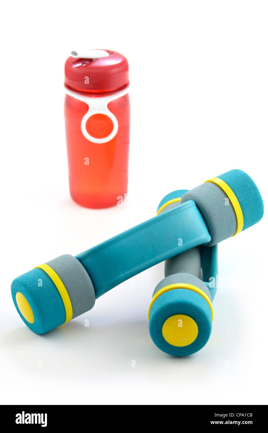 Small hand weights and water bottle on white background Stock Photo - Alamy