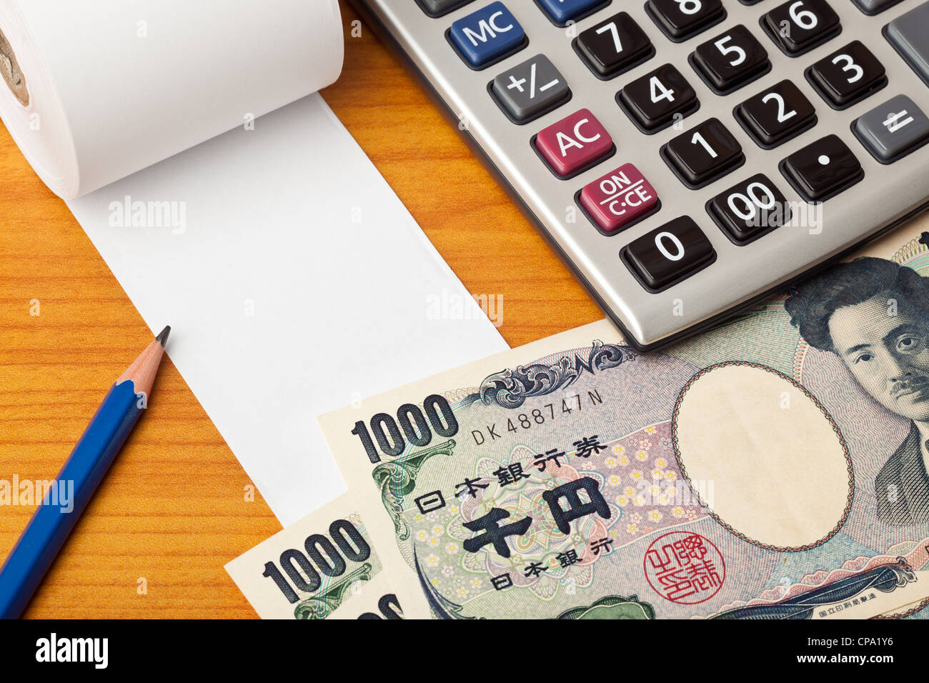 Blank list with Japanese money,calculator and pencil on a table Stock ...