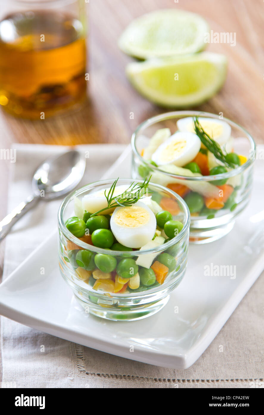 Quail egg with pea salad Stock Photo - Alamy