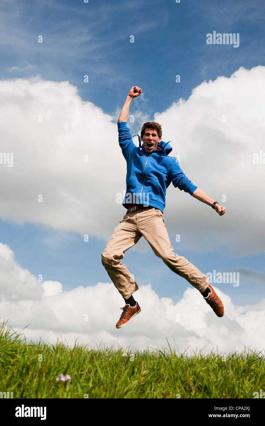 Happy jumping man outdoor in the fields Stock Photo - Alamy