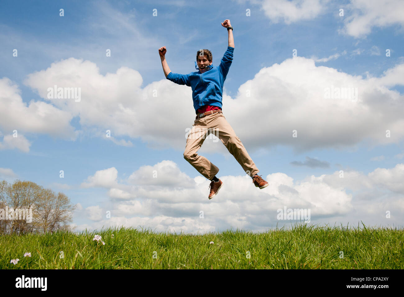 Happy jumping man outdoor in the fields Stock Photo - Alamy